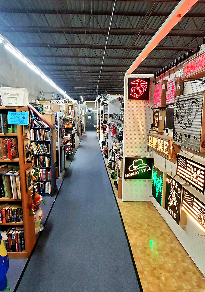 Neon signs illuminate a path through literary treasures and illuminated Americana. This aisle is basically a road trip through nostalgic America.