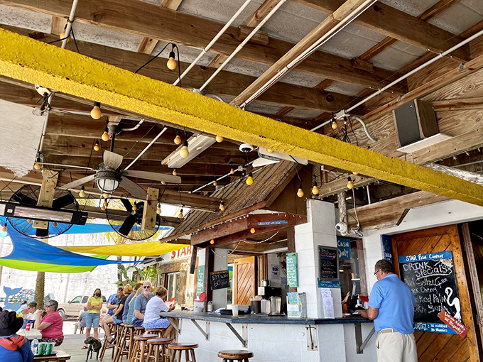 No mixologists or fancy cocktail menus here—just honest drinks served under a ceiling that's seen a thousand fishing tales.