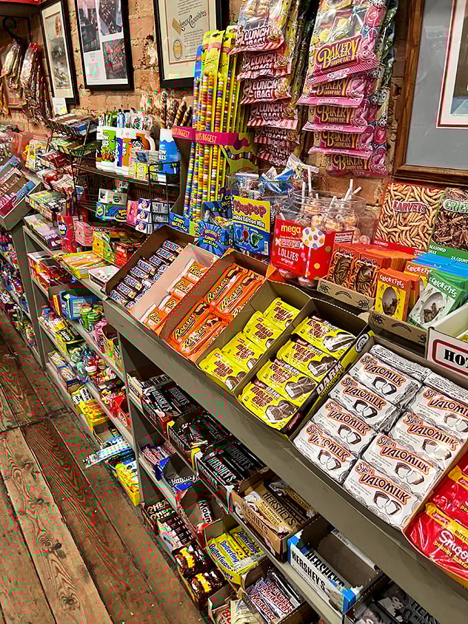 Rows of nostalgic candy bars arranged like a timeline of American childhood – each wrapper a portal to a different decade.