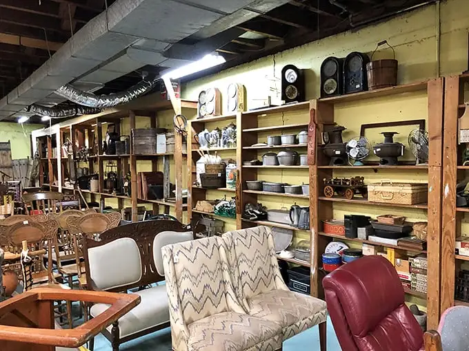 Furniture that tells stories sits patiently waiting for new homes—that chevron loveseat has probably heard more family secrets than a therapist.
