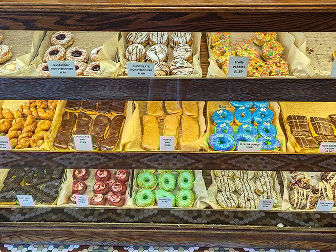Donut real estate has never been more valuable. Each shelf displays edible art that makes choosing just one a delicious dilemma.