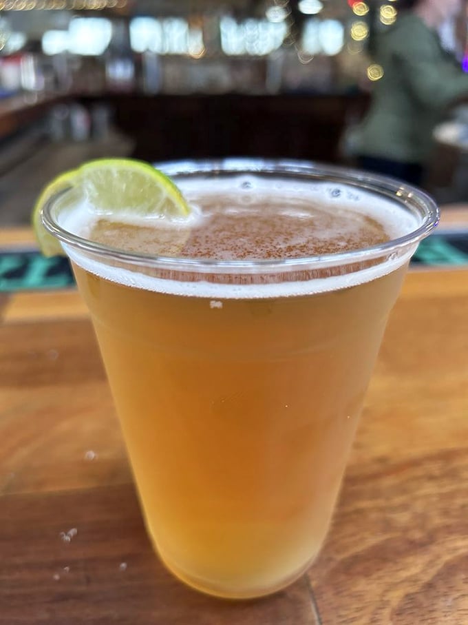 A cold beer with a lime wedge—the official beverage of "I've escaped the real world for a few blessed hours."