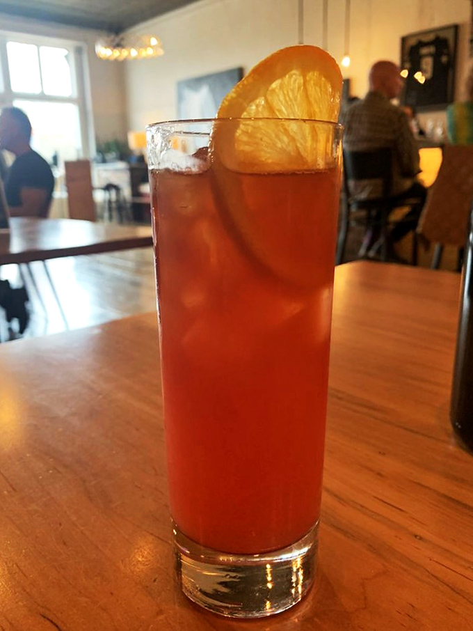 This isn't just a cocktail—it's liquid sunshine in a glass. The perfect companion while you debate which brick oven pizza to order next.