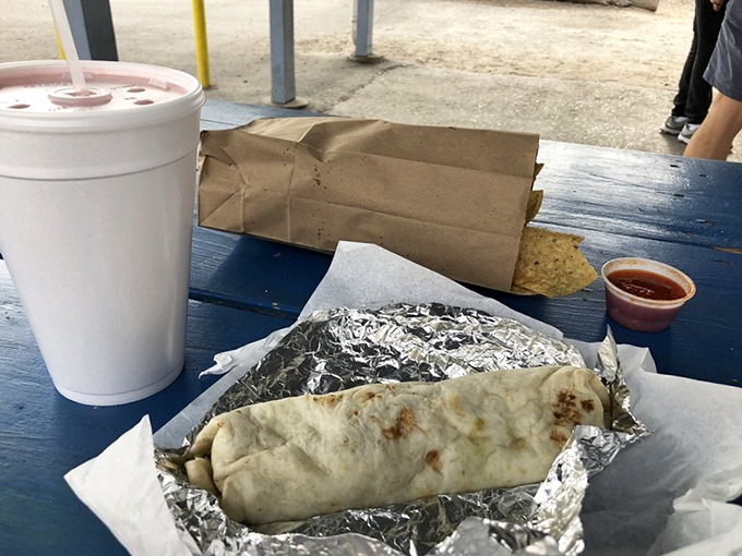 The classic New Mexican lunch setup – burrito, chips, salsa, and the promise of a very satisfying afternoon nap in your immediate future.