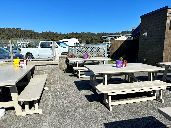 Outdoor dining at its most honest—picnic tables, ocean breezes, and the promise of chowder without pretense or reservation requirements.