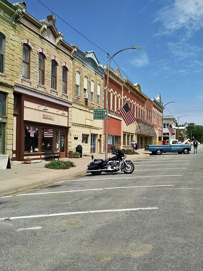 Downtown Peabody looks like a movie set, but those flags aren't props – they're genuine small-town pride.