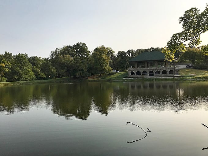 Fort Scott's serene park offers a peaceful retreat from modern life. That glassy water reflects the town's natural beauty perfectly.