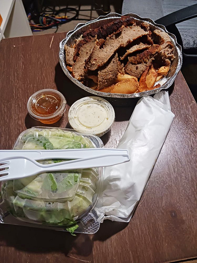 This isn't just a plate of meat—it's a flavor autobiography written in perfectly seasoned slices. The tzatziki is the epilogue you can't stop reading.