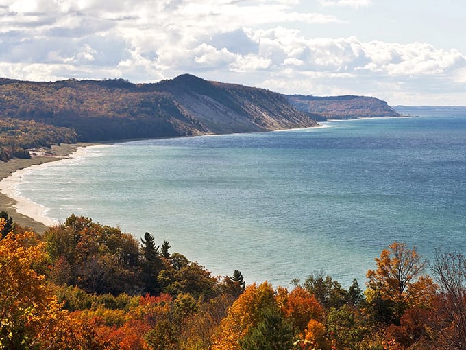 Mother Nature showing off her fall color palette along Lake Michigan's shoreline. Those dunes aren't just scenic—they're geological rock stars dating back thousands of years.