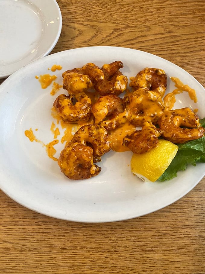 These Boom Boom Shrimp aren't just appetizers—they're little orange-sauced flavor bombs that should come with a warning label: highly addictive.
