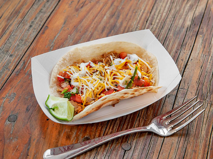 This taco isn't just assembled, it's composed—a harmonious arrangement of colors, textures, and flavors that Mozart would have written a symphony about.