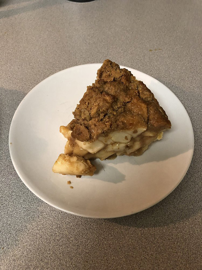 This slice of Apple Crumb pie isn't just leaving the plate—it's leaving behind all your preconceived notions about what apple pie can be.