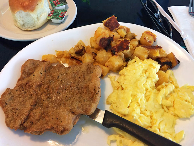 Country fried steak with eggs and home fries – the breakfast equivalent of a warm hug from your favorite aunt who never counted calories.