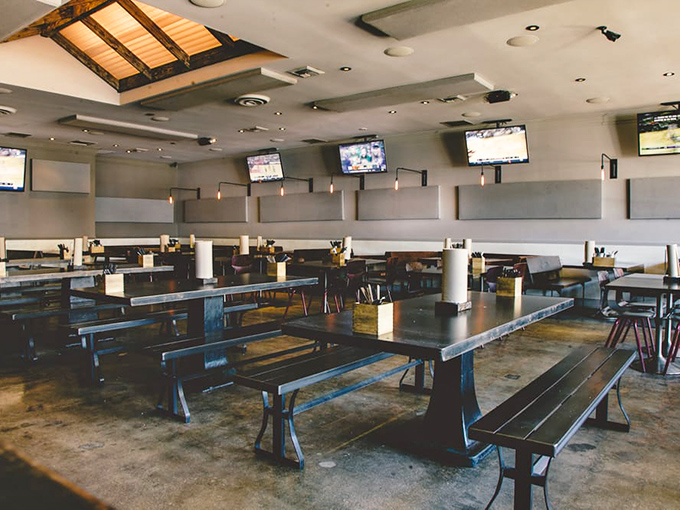 The communal tables aren't just practical—they're philosophical. Nothing brings strangers together faster than the shared experience of exceptional barbecue.