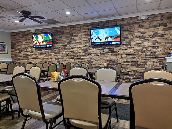 The stone wall dining area offers that perfect blend of casual comfort and subtle nautical charm—where nobody's rushing you through your crab-picking marathon.