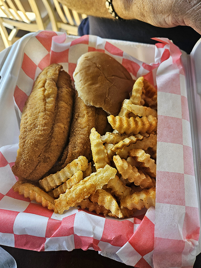 The classic flounder sandwich with crinkle-cut fries – comfort food that doesn't need to shout to make its delicious point.