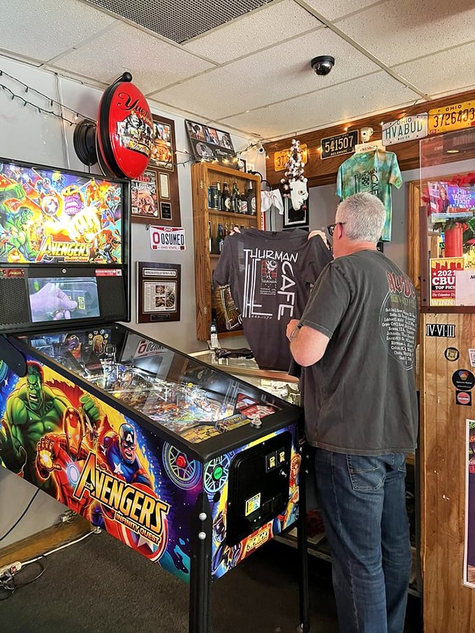 Between burger battles, patrons can test their skills at the Avengers pinball machine, where saving the universe seems easier than finishing a Thurmanator.