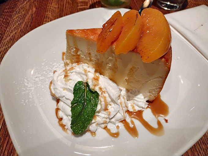 Georgia-style cheesecake with caramelized peaches—where New York tradition meets Southern charm in the most delicious diplomatic summit imaginable.