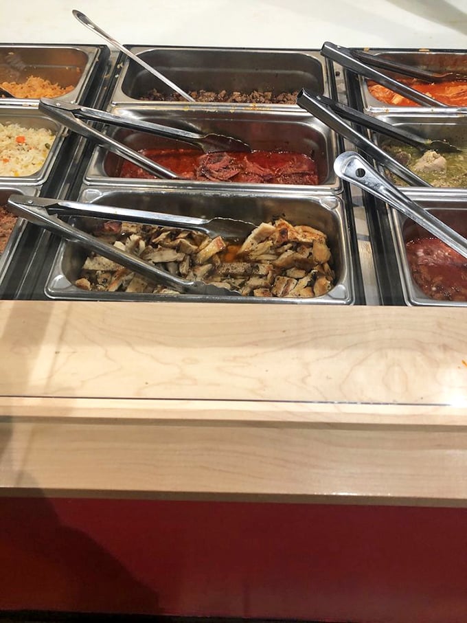 The buffet line of meats and sauces—where decisions get tough and "I'll take everything" becomes a legitimate ordering strategy.