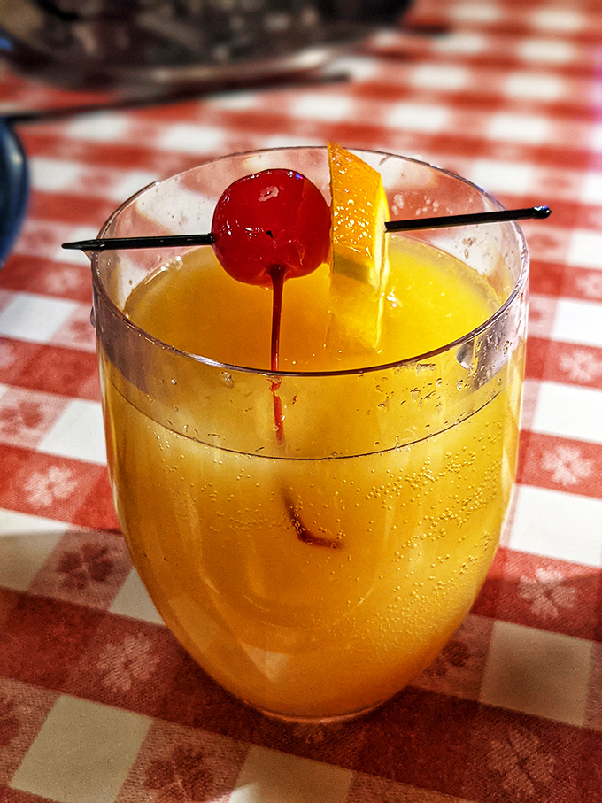 A mimosa with a cherry on top—because sometimes breakfast needs a little sparkle. It's not morning drinking; it's breakfast enhancing!