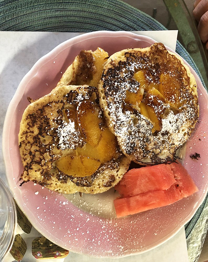 These peach pancakes aren't just breakfast—they're morning therapy. The dusting of powdered sugar is like fresh snow on a perfect landscape.