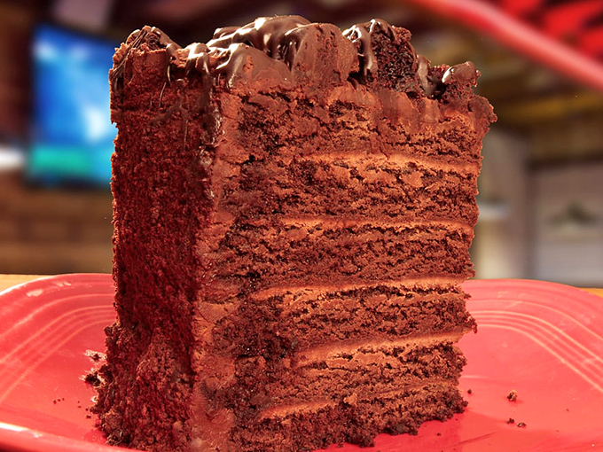 Layer upon layer of chocolate conspiracy. This cake doesn't just satisfy cravings—it creates chocolate dependencies.
