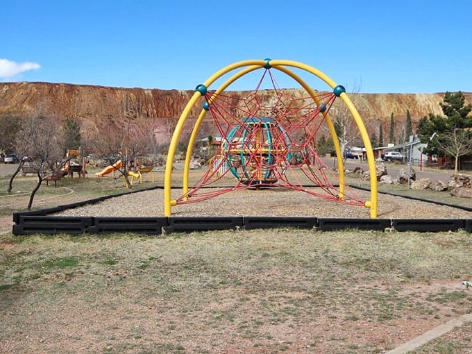 This playground sits in the shadow of the Lavender Pit mine – childhood joy meets industrial history in one colorful frame.