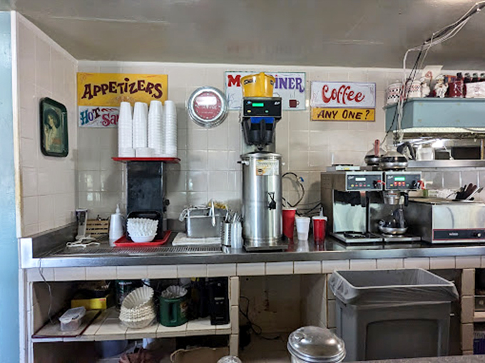 The coffee station – command central for the lifeblood of any respectable diner. That "COFFEE... ANY ONE?" sign isn't really asking a question.