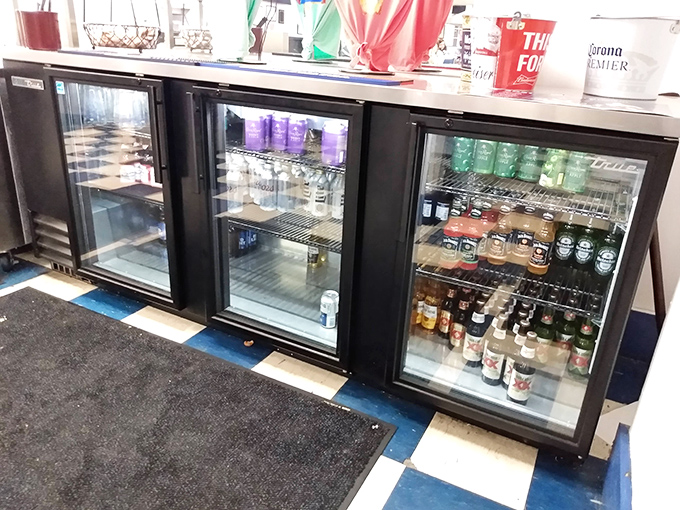 The beverage cooler—where decisions are harder than picking lottery numbers. Cold drinks waiting to wash down whatever Southern delicacy you've chosen.