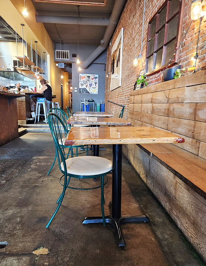 The dining room feels like the coolest friend's apartment—if that friend happened to be an exceptional cook. Industrial meets cozy in perfect harmony.