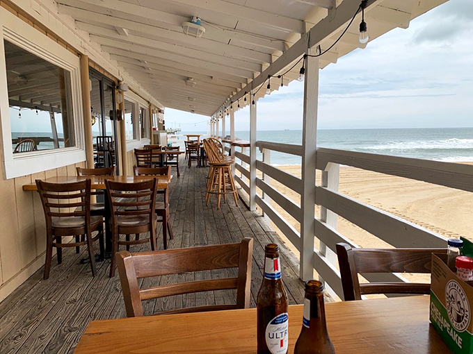 Dining on the weathered deck with the Atlantic as your dinner companion—the kind of million-dollar view that makes everything taste better.