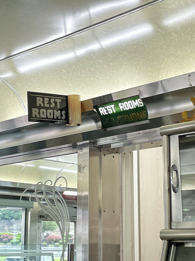 Even the "Rest Rooms" sign maintains period authenticity. In the diner universe, no detail is too small for nostalgic preservation.