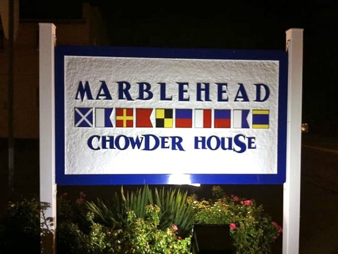 Those nautical flags aren't just decoration—they're silently spelling out "Get in here before the locals eat all the chowder."
