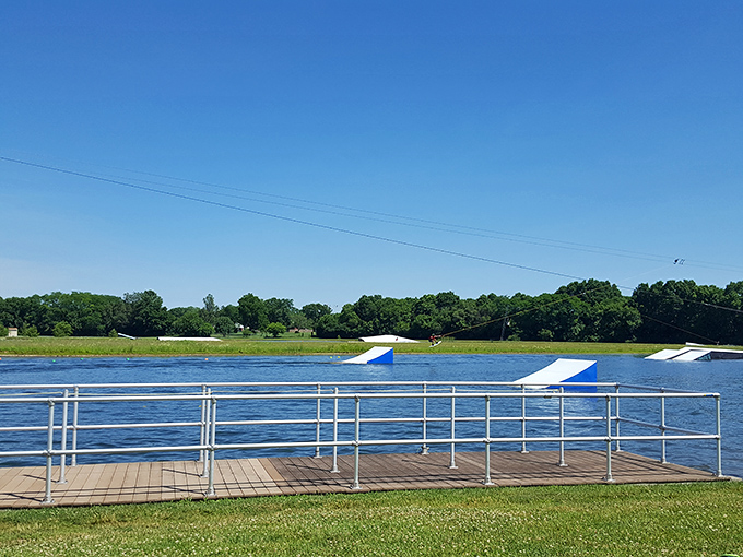 The calm before the action—Wake Nation's pristine lake and ramps await the day's adventurers under a perfect blue Ohio sky.