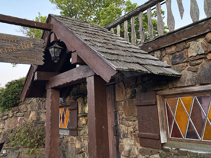 The Swiss chalet of your dreams isn't in the Alps—it's hiding in Arkansas! This stone-and-timber entrance promises Old World magic behind that wooden door.