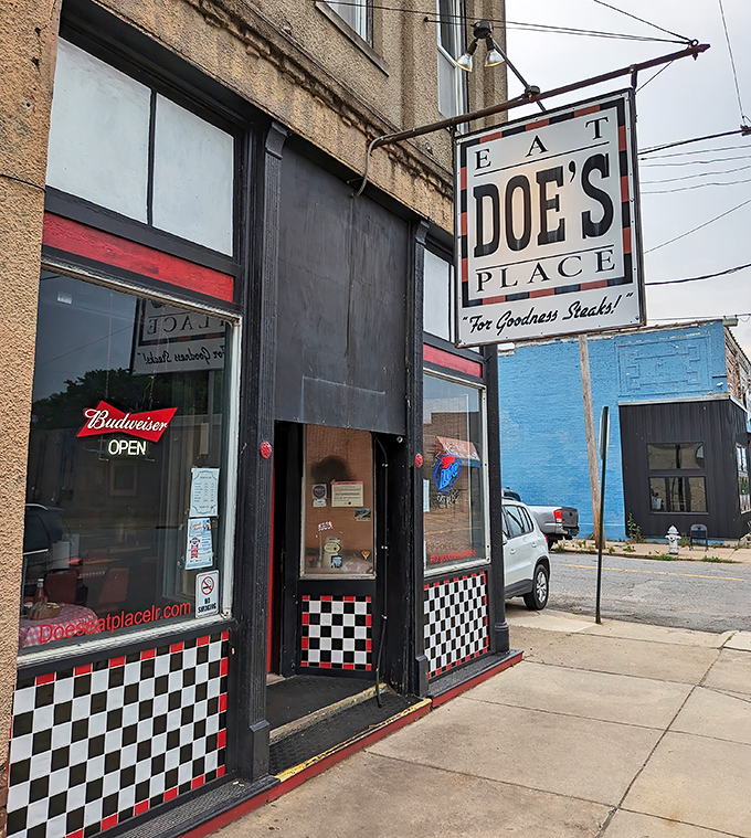 The unassuming exterior of Doe's Eat Place hides culinary greatness within, like finding a diamond in your backyard. That yellow truck knows what's up! 