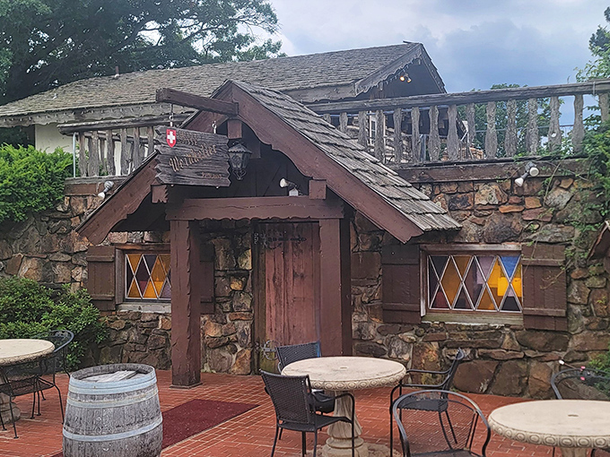 The Swiss chalet of your dreams isn't in the Alps—it's hiding in Arkansas! This stone-and-timber entrance promises Old World magic behind that wooden door. 