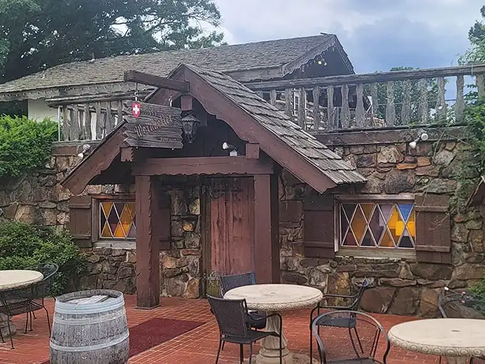 The Swiss chalet of your dreams isn't in the Alps—it's hiding in Arkansas! This stone-and-timber entrance promises Old World magic behind that wooden door.