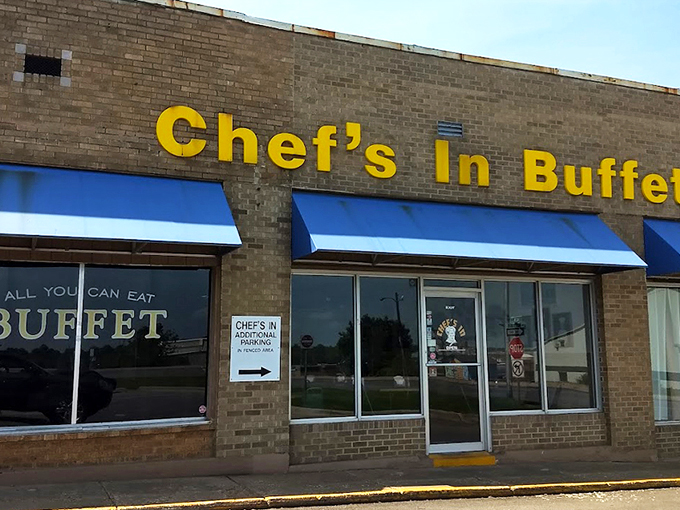 The unassuming brick exterior with bright blue awnings is like a culinary Clark Kent – ordinary on the outside, superhero-level deliciousness within.