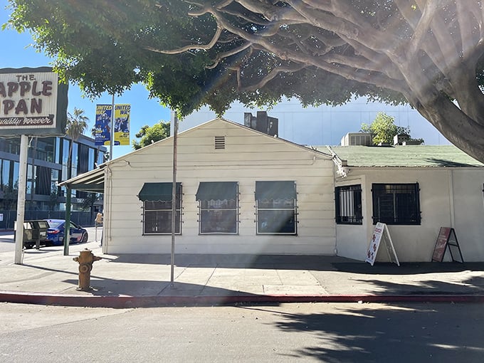 The unassuming exterior of The Apple Pan stands like a time capsule amid modern LA, its vintage sign promising "Quality Forever" – a bold claim they've somehow managed to keep.