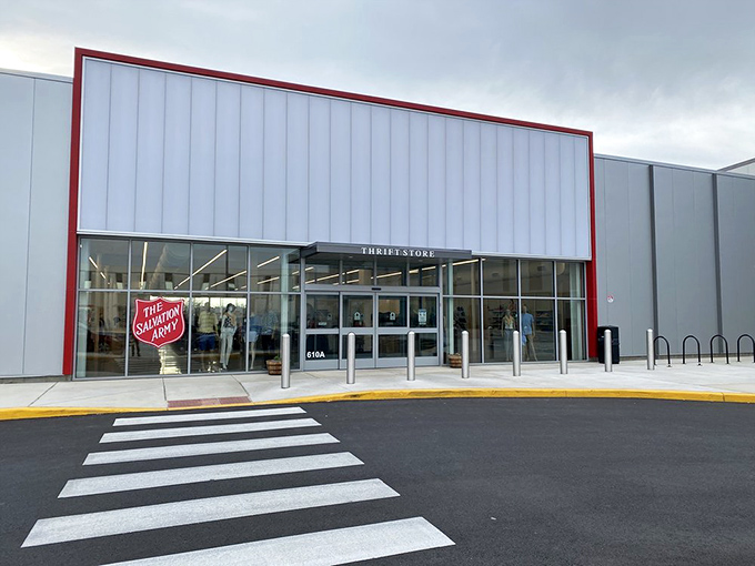 The gleaming white exterior with its bold red trim isn't just a building—it's a portal to possibility. Treasure awaits inside.