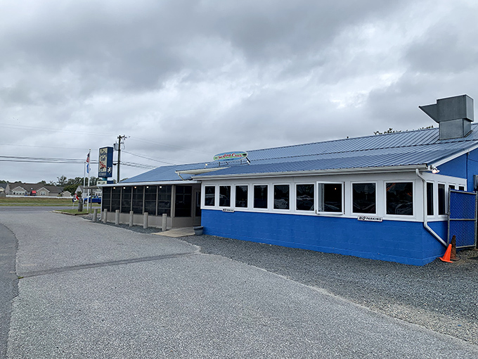 The blue exterior with its cheerful yellow surfboard sign isn't trying to impress anyone—until you taste what's inside. Coastal dining at its unpretentious best.