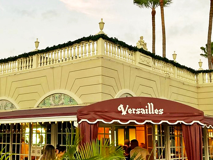 The palace of Cuban cuisine stands regally on Calle Ocho, its yellow façade and burgundy awning beckoning hungry pilgrims like a delicious mirage.