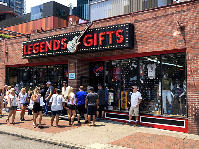 The iconic red Legends Gifts storefront beckons like a siren song to Nashville visitors. That guitar silhouette isn't just decoration—it's a promise of melodious treasures within.