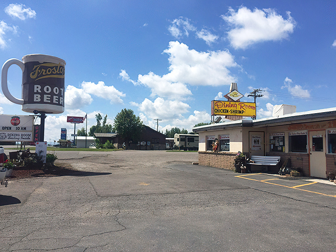 The time-capsule exterior of Frostop Drive In beckons with its vintage signage and welcoming bench—a portal to simpler, more delicious times.