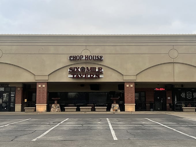 The unassuming exterior of Six Mile Chop House belies the carnivorous paradise within. Red neon beckons hungry Kansans like a lighthouse for the beef-obsessed.