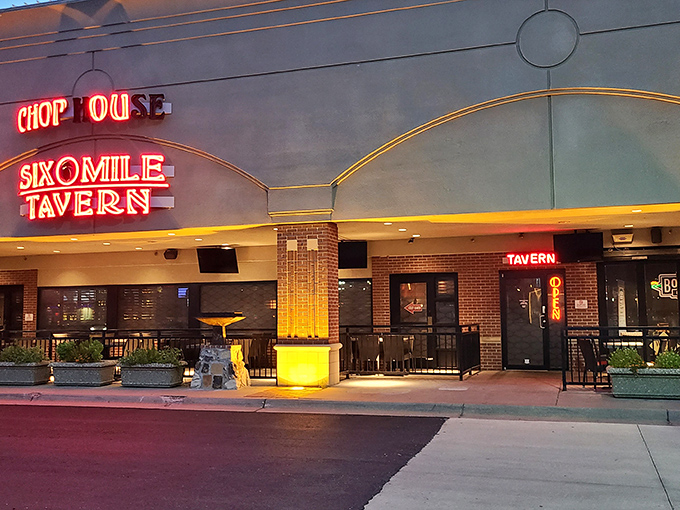 The unassuming exterior of Six Mile Chop House belies the carnivorous paradise within. Red neon beckons hungry Kansans like a lighthouse for the beef-obsessed.
