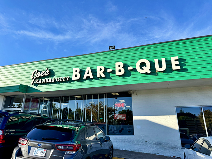 The iconic green exterior of Joe's Kansas City Bar-B-Que stands as a beacon of hope for hungry travelers—proof that extraordinary food often hides in ordinary places.