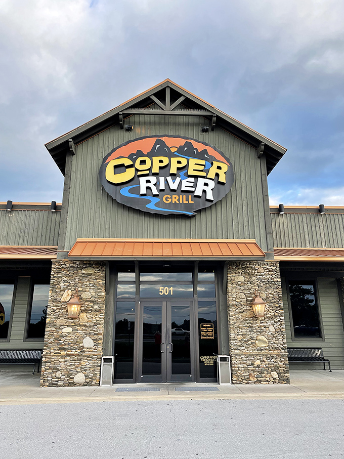 The rustic lodge-inspired exterior of Copper River Grill stands like a culinary beacon in Nicholasville, promising mountain-worthy meals in Kentucky's heartland.