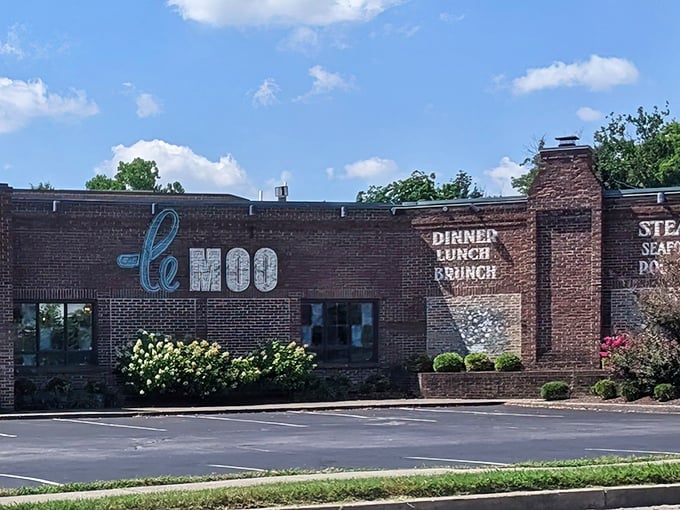 The brick façade of Le Moo welcomes hungry visitors like a carnivore's storybook cottage. Rustic charm meets upscale dining at Louisville's premier steakhouse destination.